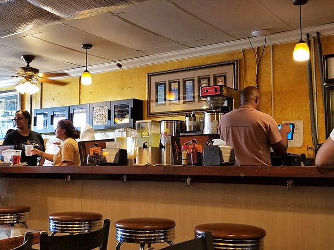 Where the magic happens. Counter seats offer front-row views to the orchestrated chaos that produces Atlanta's most beloved comfort food.