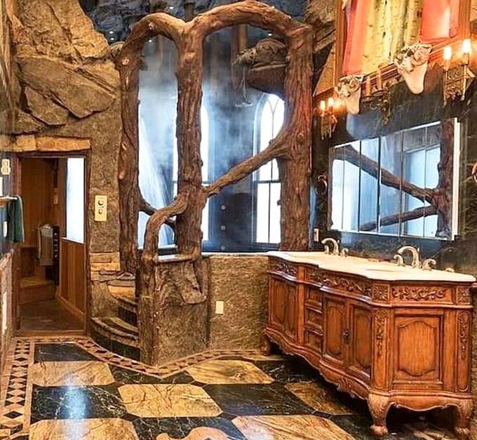 Even the bathroom embraces fantasy with carved tree elements framing mirrors. Washing your hands has never felt so enchanted or Instagram-worthy.
