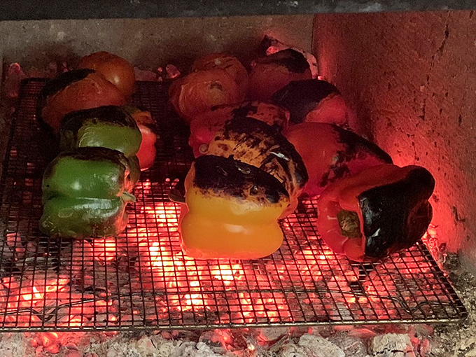 Behind every great barbecue joint is a fire&mdash;these peppers roasting over open flames are about to become something magical.