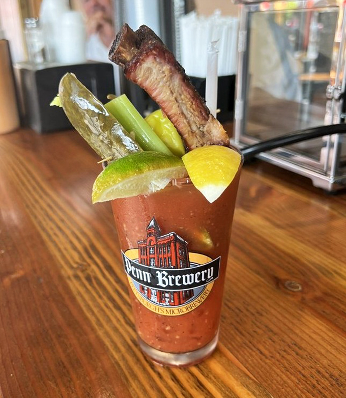 A Bloody Mary garnished with a rib bone isn't just a drink—it's a mission statement about how seriously this place takes both barbecue and beverages.