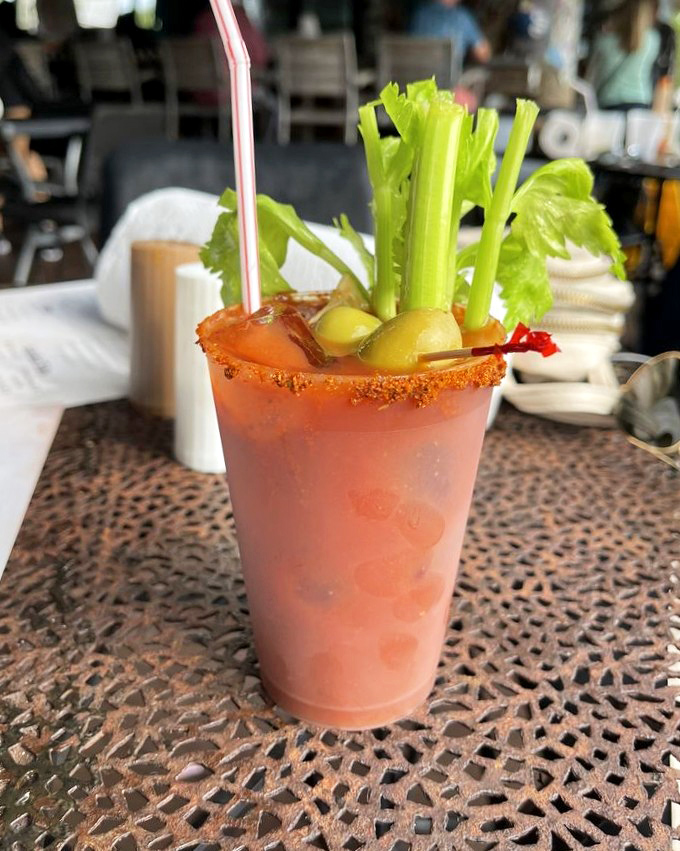 This bloody mary comes loaded with enough garnishes to qualify as a small salad with a vodka dressing.