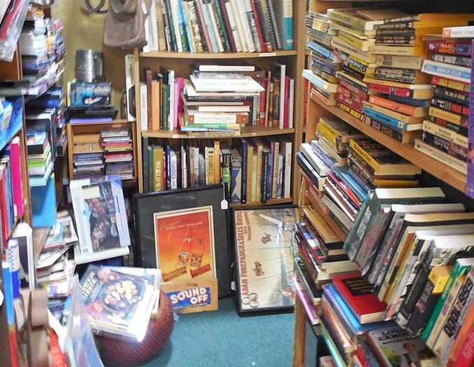 Books stacked like literary treasure chests, each spine promising adventures that screens simply cannot replicate.