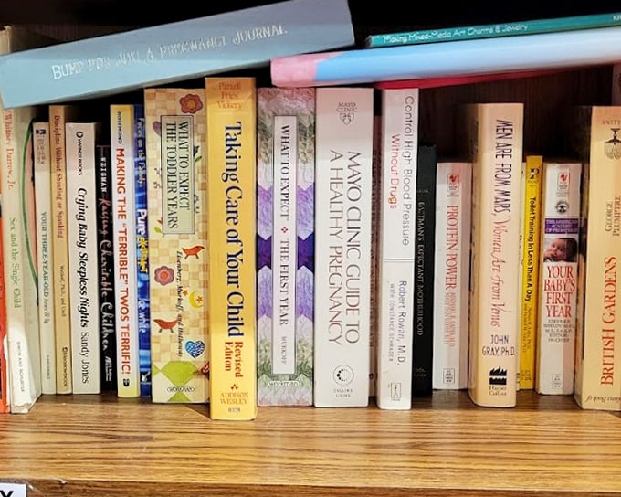 Self-help books that have already helped someone else&mdash;now it's your turn. "Taking Care of Your Child" sits ironically next to "We're Having a Baby"&mdash;the circle of life.