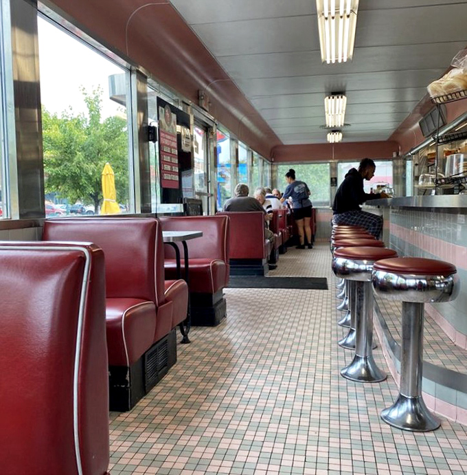 The marriage of red vinyl and vintage music memorabilia creates the kind of atmosphere where calories don't count and time slows down.