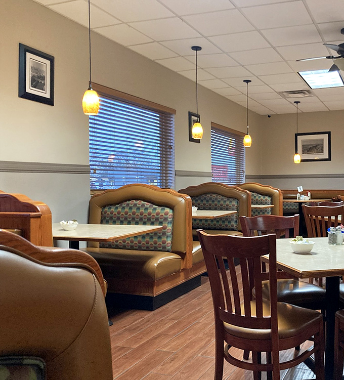 Cozy booths bathed in warm pendant lighting create the perfect backdrop for both first dates and fiftieth anniversaries. The wood paneling isn't retro &ndash; it's timeless.