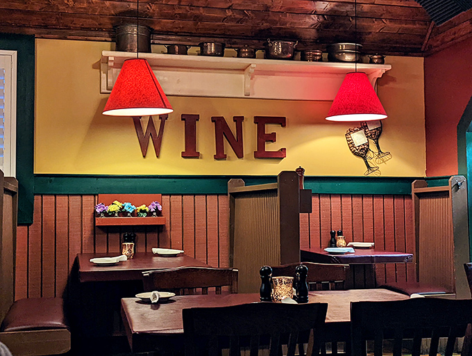 The "WINE" sign isn't just decor&mdash;it's a mission statement. Those red lampshades cast a glow that makes everyone look like they've made excellent life choices.
