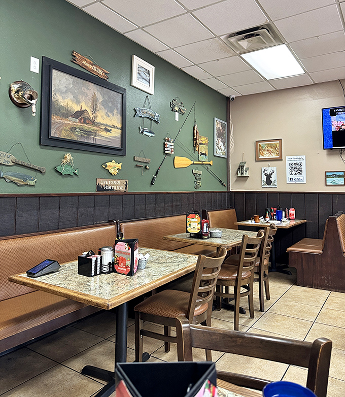 Green walls adorned with fishing treasures create the perfect backdrop for conversations that meander like a lazy Florida stream.