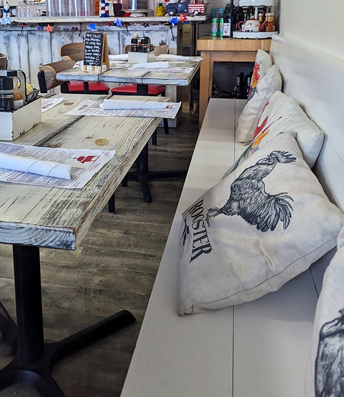 The cozy interior features rooster-emblazoned pillows that remind you exactly where your breakfast loyalty should lie. Subtle? No. Charming? Absolutely.
