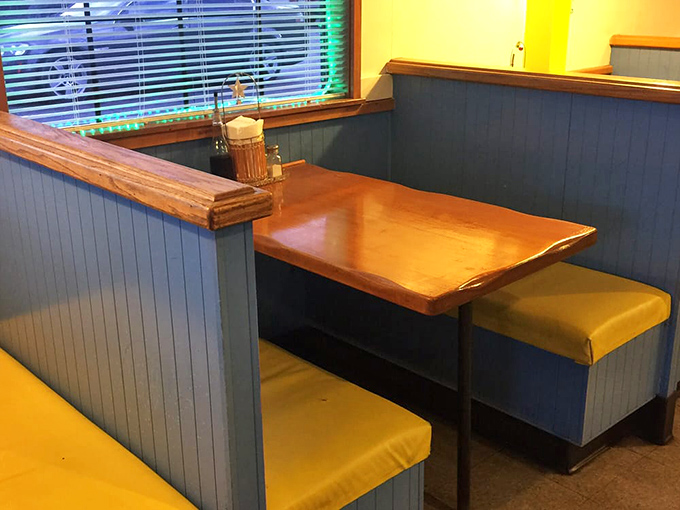Cozy booths with those unmistakable yellow cushions &ndash; the kind of comfortable seating that invites you to linger over just one more hush puppy.