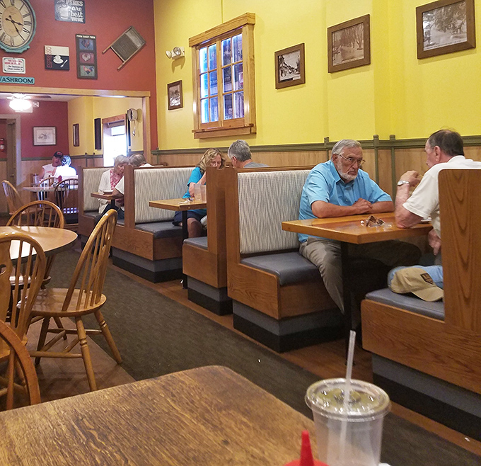 Wooden booths worn smooth by decades of elbows and conversations &ndash; these aren't just seats, they're community archives.