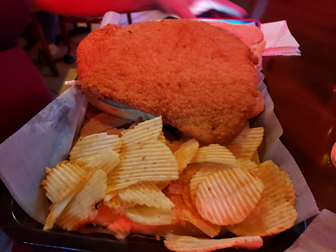 The breaded pork tenderloin sandwich&mdash;Indiana's unofficial state food&mdash;hangs dramatically over its plate like a crispy, delicious eclipse of the bread.