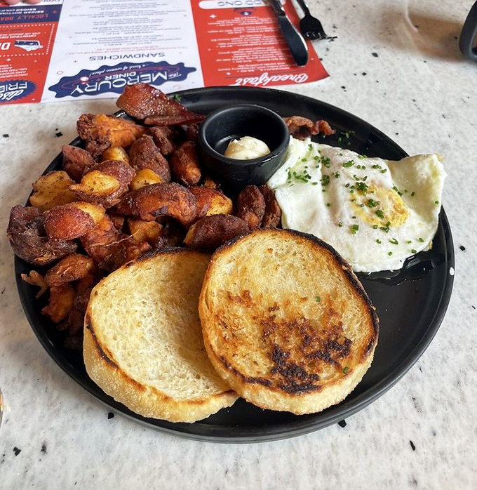 Breakfast perfection: crispy potatoes, golden toast, and an egg so perfectly cooked it deserves its own Instagram account. Morning glory, indeed.