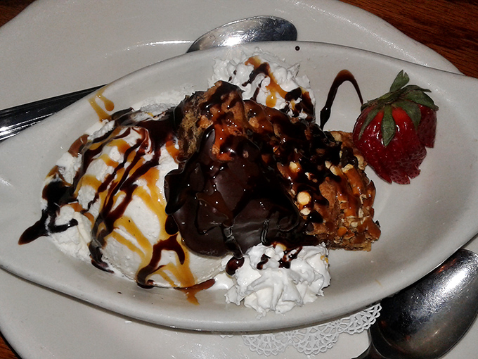 Dessert that doesn't know the meaning of restraint&mdash;warm brownie, cool ice cream, and sauces that zigzag with reckless, delicious abandon.
