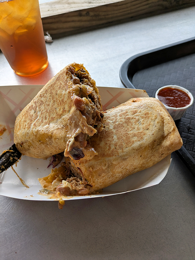 BBQ goes undercover in this massive burrito. Pulled pork wrapped in a tortilla proves that good barbecue transcends traditional serving methods.