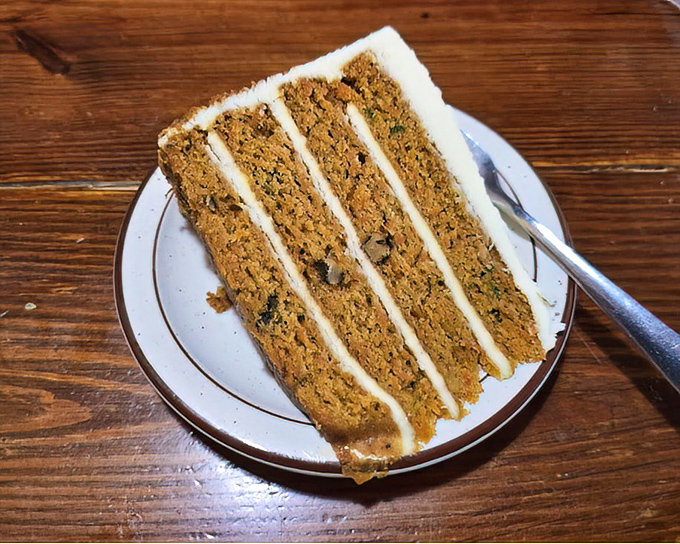 Four layers of carrot cake that could double as architecture. This isn't dessert&mdash;it's a monument to the power of cream cheese frosting.