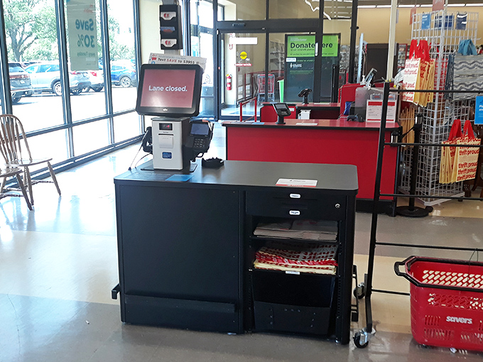 The checkout: final gateway between impulse and ownership, where treasures receive their new lease on life.