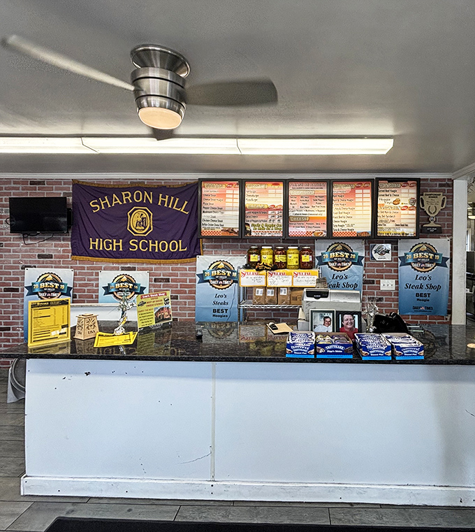 Where the magic happens&mdash;dedicated sandwich crafters working their culinary choreography behind the counter, turning orders into edible art.
