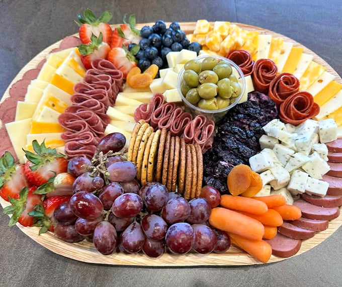 This isn't just a charcuterie board; it's an edible work of art where meats, cheeses, and fruits perform a harmonious culinary ballet.