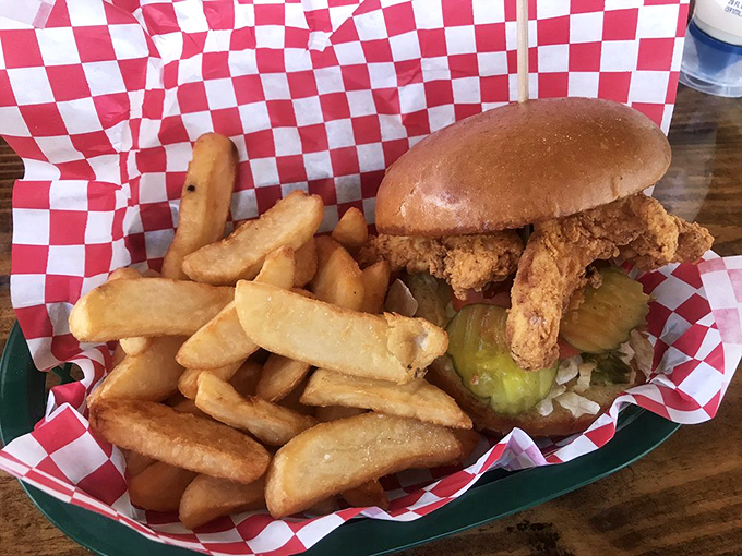 A chicken sandwich that could make you forget you came for seafood. That pickle peaking out is making promises the sandwich fully intends to keep.