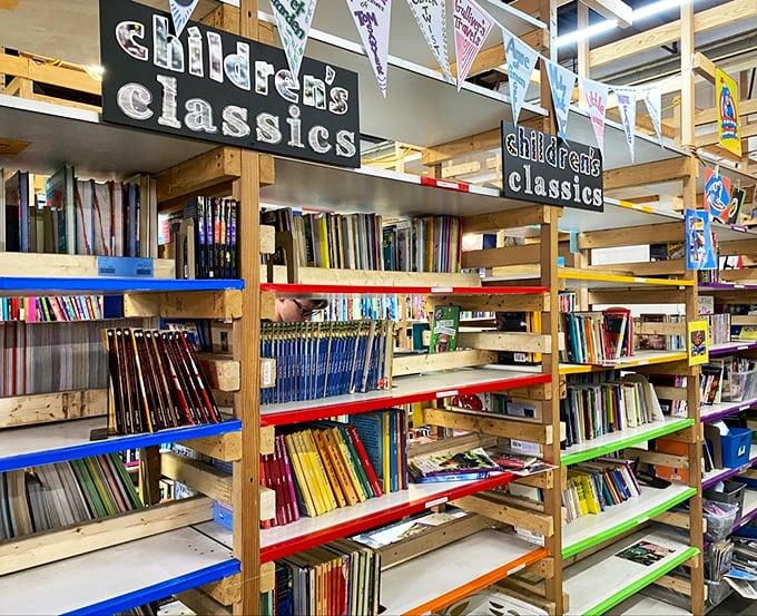 The Children's Classics section, where colorful shelves hold the stories that shaped our childhoods, ready to work their magic on a new generation of imaginative minds.