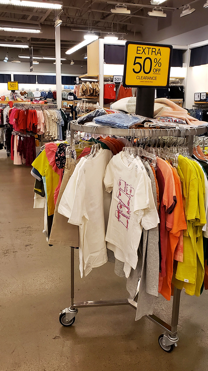 The "Extra 50% Off" sign &ndash; retail poetry that speaks directly to the soul. These aren't just clothes; they're trophies from the discount hunting games.