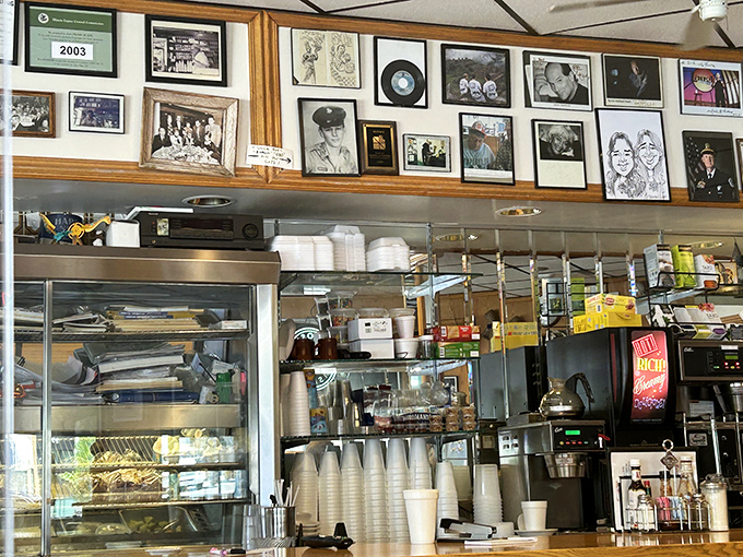 The wall of memories above the coffee station tells you everything&mdash;this isn't just a restaurant, it's a community archive of shared moments.