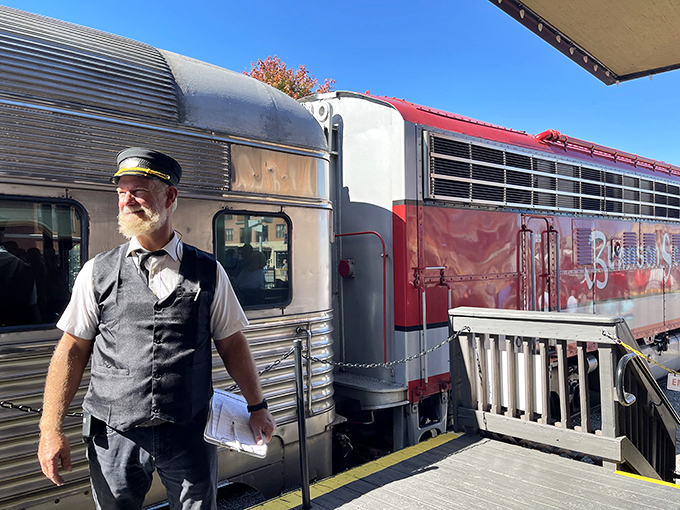The conductor steps out in period-perfect attire, ready to punch tickets and transport passengers across miles and decades simultaneously.