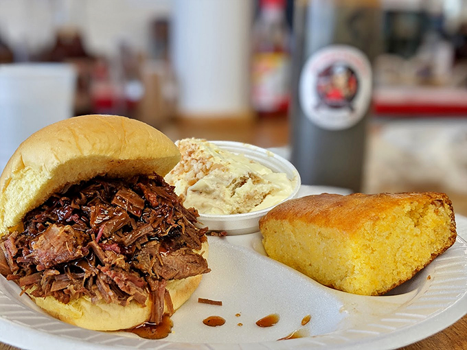 A pulled pork sandwich with coleslaw and cornbread that doesn't need Instagram filters&mdash;it's already the supermodel of BBQ plates.