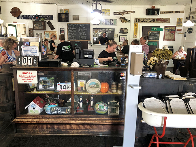 Behind this counter, Southern magic happens. The display case tempts with treasures while staff orchestrate the delicious chaos with practiced ease.