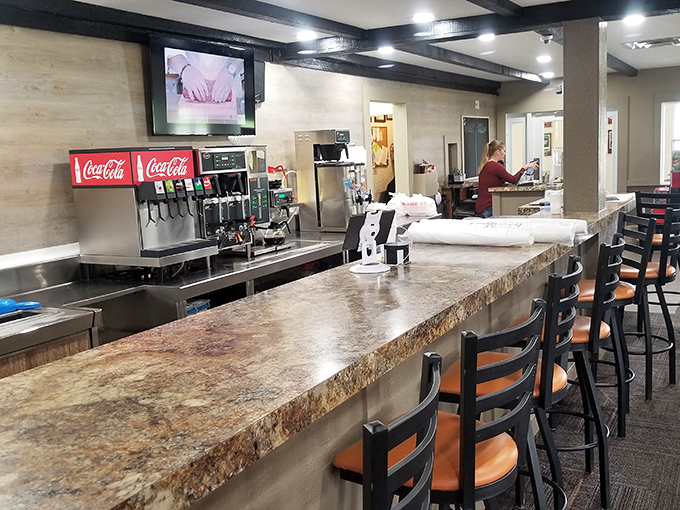 At this counter, coffee refills flow freely and conversations bounce between booths like a friendly game of verbal ping-pong. 