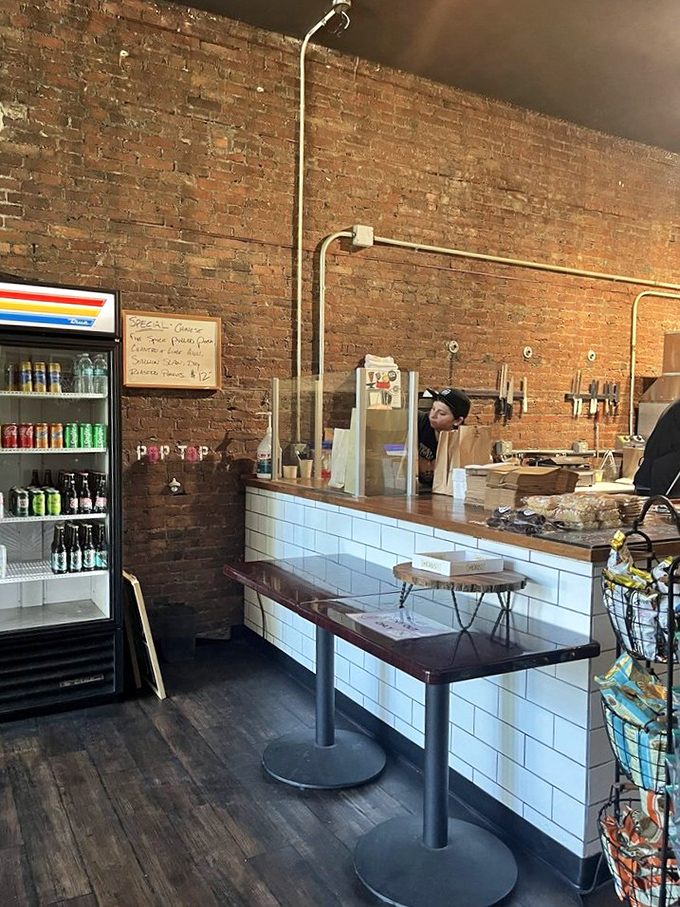 Behind this counter, sandwich artists craft edible masterpieces with surgical precision. Michelangelo had marble; they have bread and meat.