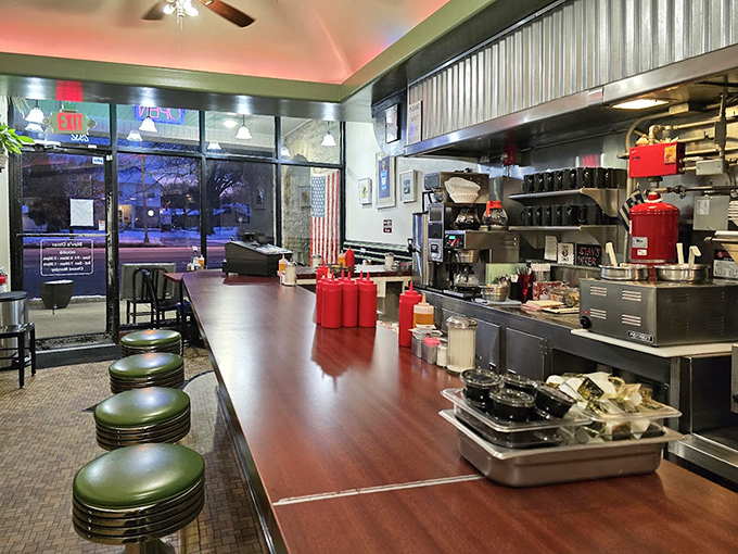 The classic diner counter where regulars gather, stories unfold, and the coffee never stops flowing from those silver pots.