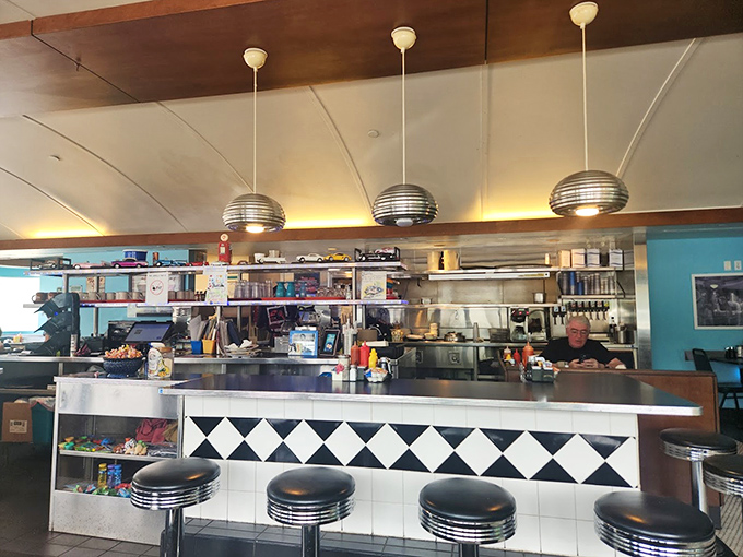 The counter where breakfast dreams come true. Those classic diner stools have witnessed countless coffee refills and "I shouldn't, but yes, I'll have pie" moments.