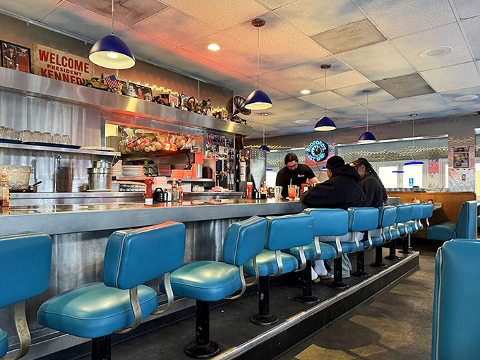 The counter seats offer front-row tickets to the short-order ballet, where coffee flows as freely as the conversation.
