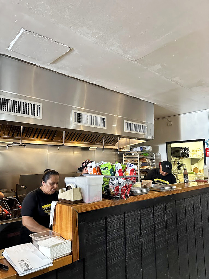 Where sandwich magic happens. The open kitchen design lets you witness culinary craftsmanship in action, building anticipation with every slice.