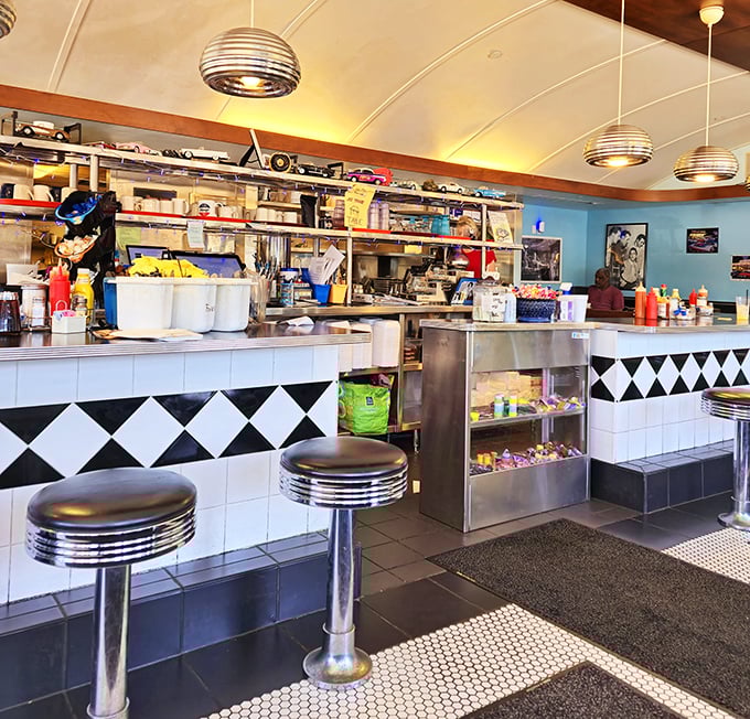 
The counter seating&mdash;where solo diners become temporary members of the Village Diner family and breakfast theater unfolds before your eyes. 