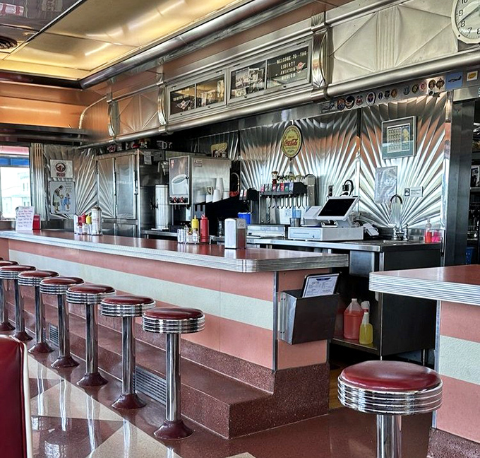 The counter gleams with decades of short-order tradition, where solo diners find community and the coffee never stops flowing.