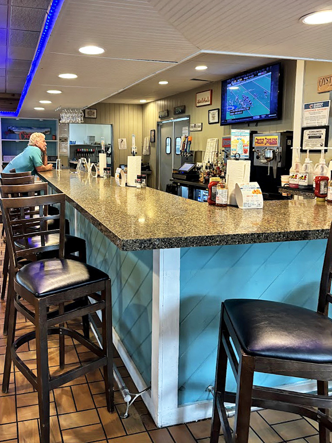 The kind of welcoming counter where regulars gather and strangers become friends over shared seafood stories.