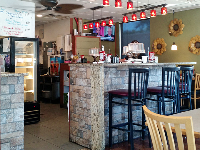 The stone-faced counter and cozy booths create that perfect diner atmosphere&mdash;casual enough for jeans, comfortable enough to linger over that second coffee.