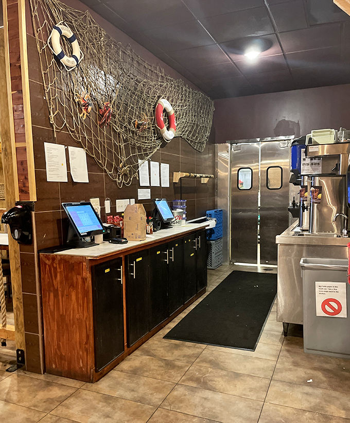 Even the service counter gets the maritime treatment, with fishing nets and life preservers creating that "fresh off the boat" atmosphere.