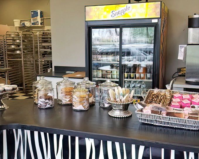 Cookie jars lined up like soldiers guarding delicious secrets. The zebra-print counter adds just the right amount of bakery sass.