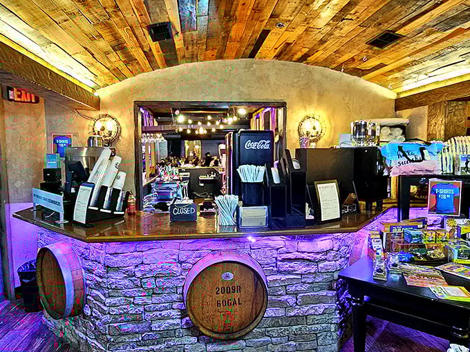 The bar area combines rustic charm with modern flair&mdash;wooden barrels meet purple lighting in a space that says, "Yes, we take our drinks as seriously as our giant meatball sculpture."
