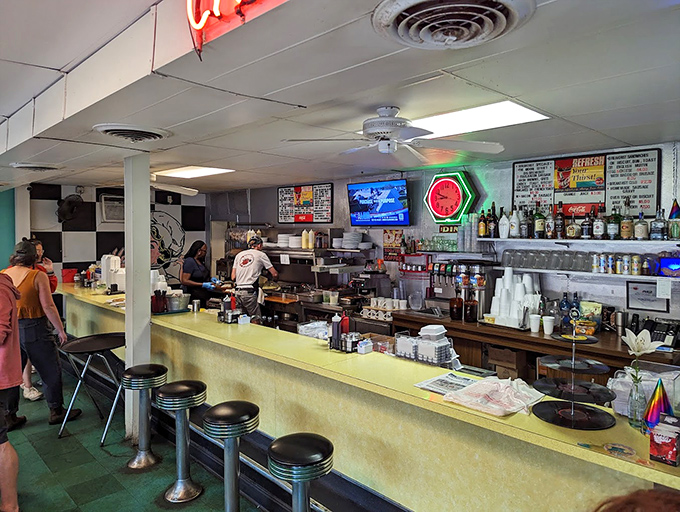 The counter view: where breakfast theater unfolds and regulars find their designated stools for the best morning show in town.
