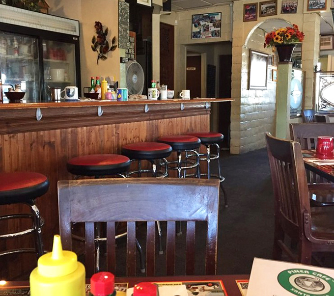 Classic counter seating where regulars exchange local wisdom and newcomers become part of the morning ritual.