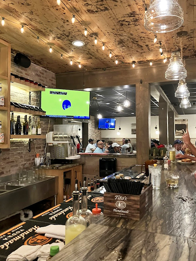 The bar gleams with promise, stocked with spirits that pair perfectly with perfectly grilled beef.