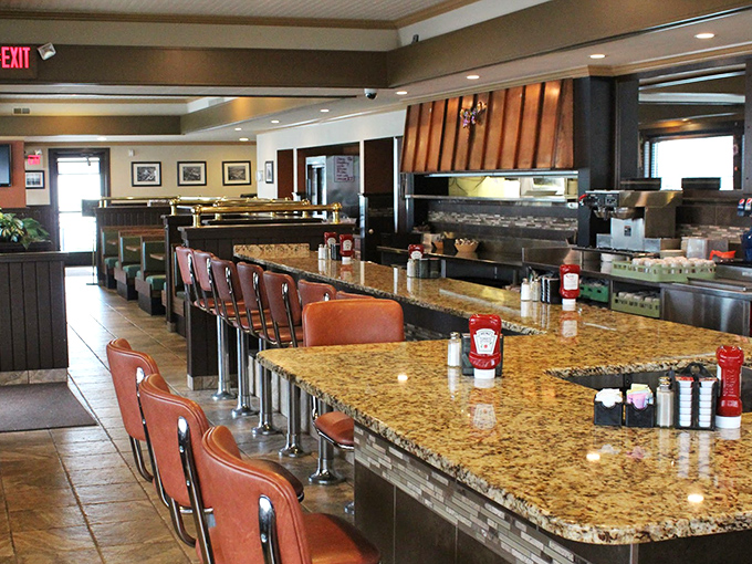 The counter seats where solo diners become part of the morning conversation, whether they planned it or not.