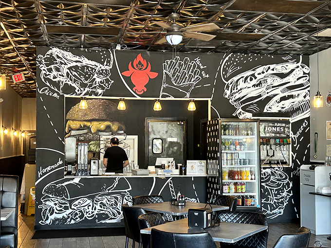 The counter where burger dreams come true, surrounded by playful food art that'll make your stomach growl in anticipation.