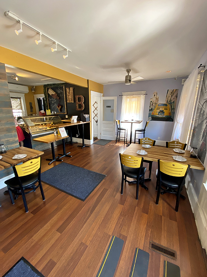 Yellow chairs pop against warm wood floors, creating a sunny disposition even on Cleveland's grayest days.
