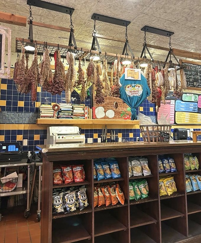 Meats hanging like edible art installations, each one a masterpiece waiting to meet fresh rye bread.