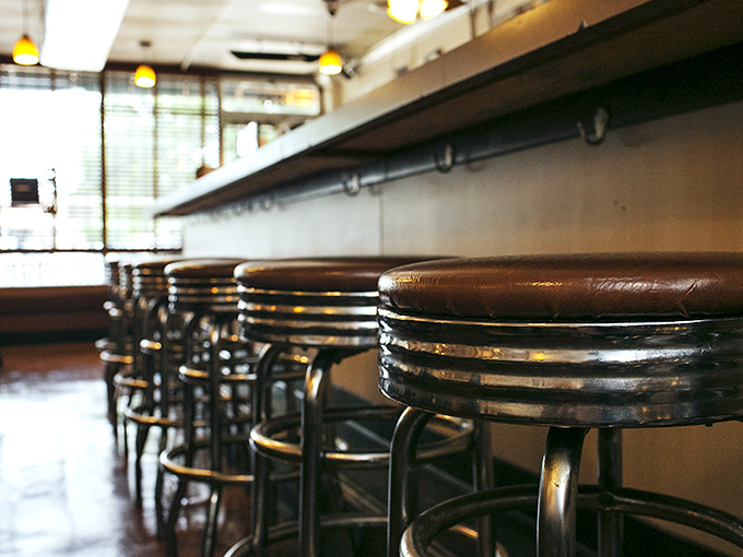 Counter seating where culinary magic unfolds before your eyes &ndash; these well-worn stools have supported generations of happy diners.